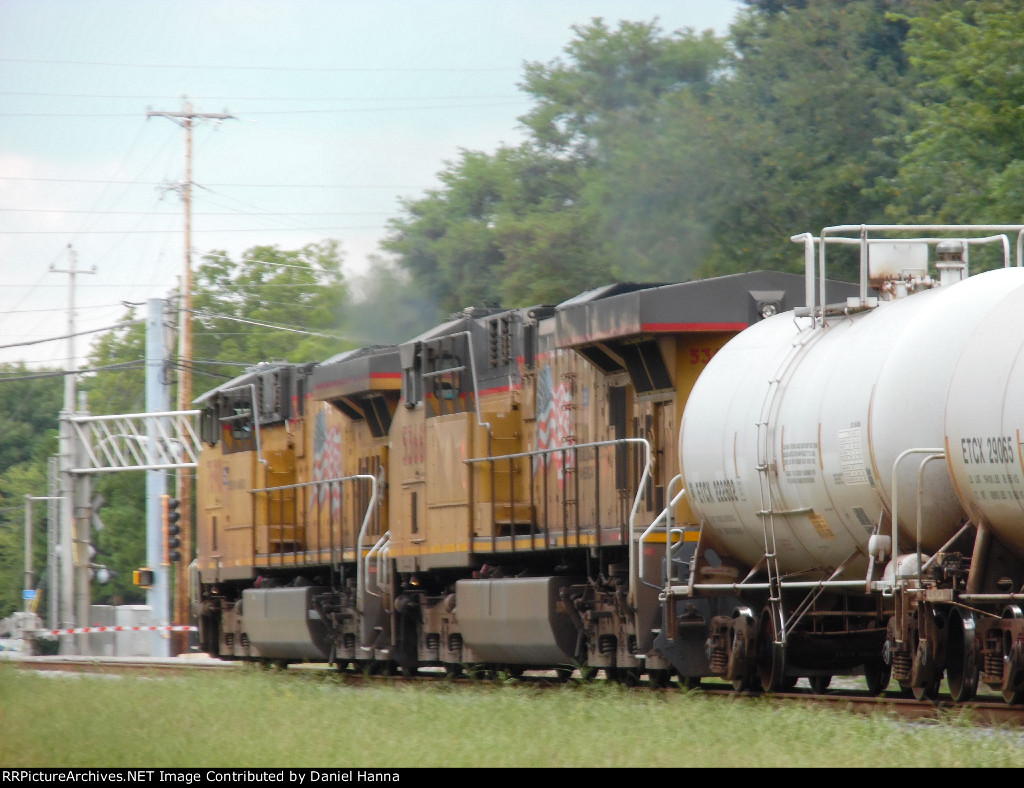 UP 7690 & 5368 are smoking hard as they head west at MP 536